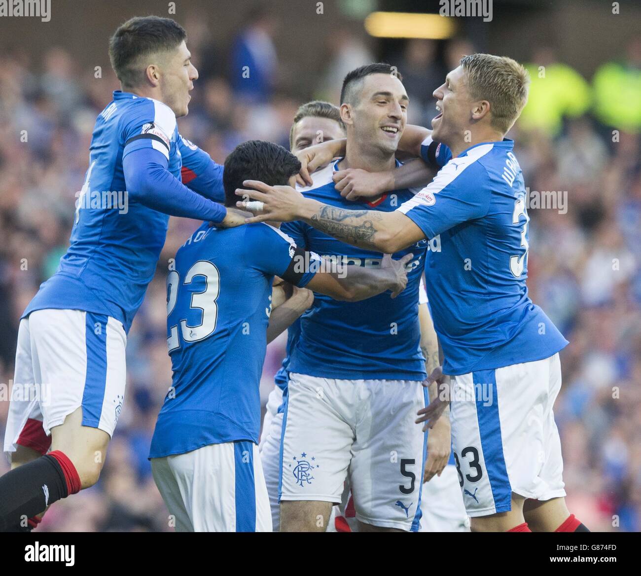 Rangers' Lee Wallace (centre) celebrates scoring his side's first goal ...