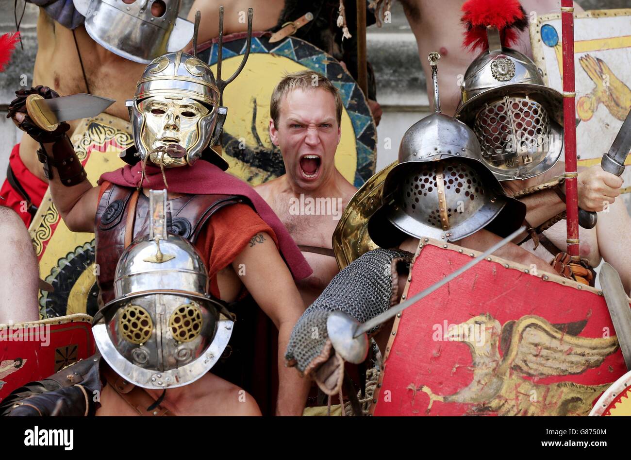 Gladiatorial performers form a display during a photo call for the ...