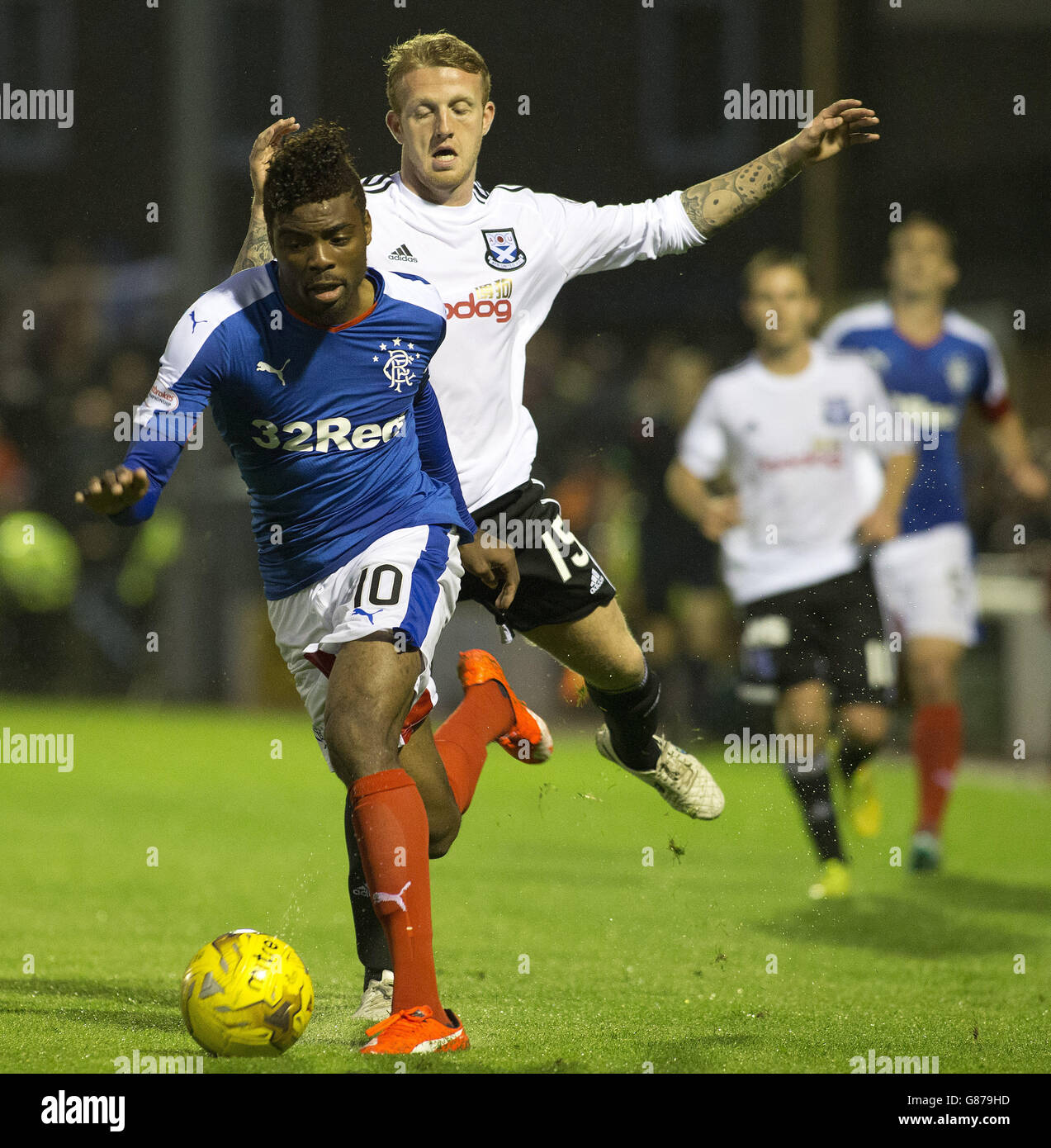 Rangers' Nathan Oduwa (left) and Ayr United's Robert Crawford battle ...