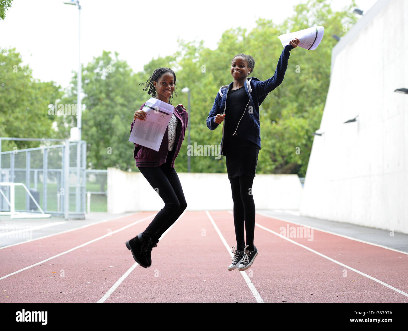 Twin sisters Onyinyechi (left) and Amarachir Orie receive their GCSE ...
