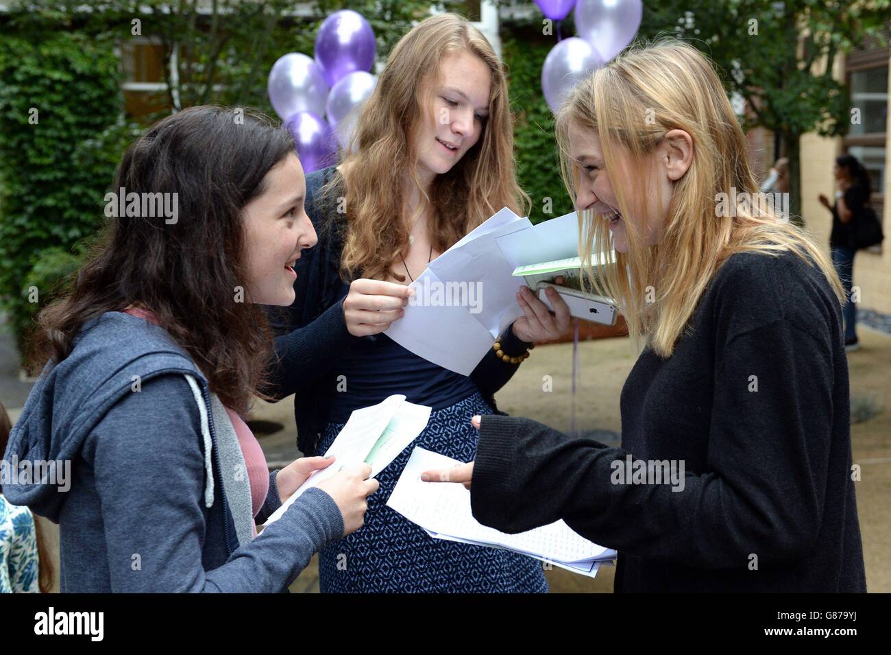 Pupils pick up their GCSE results at Putney High School in west London ...