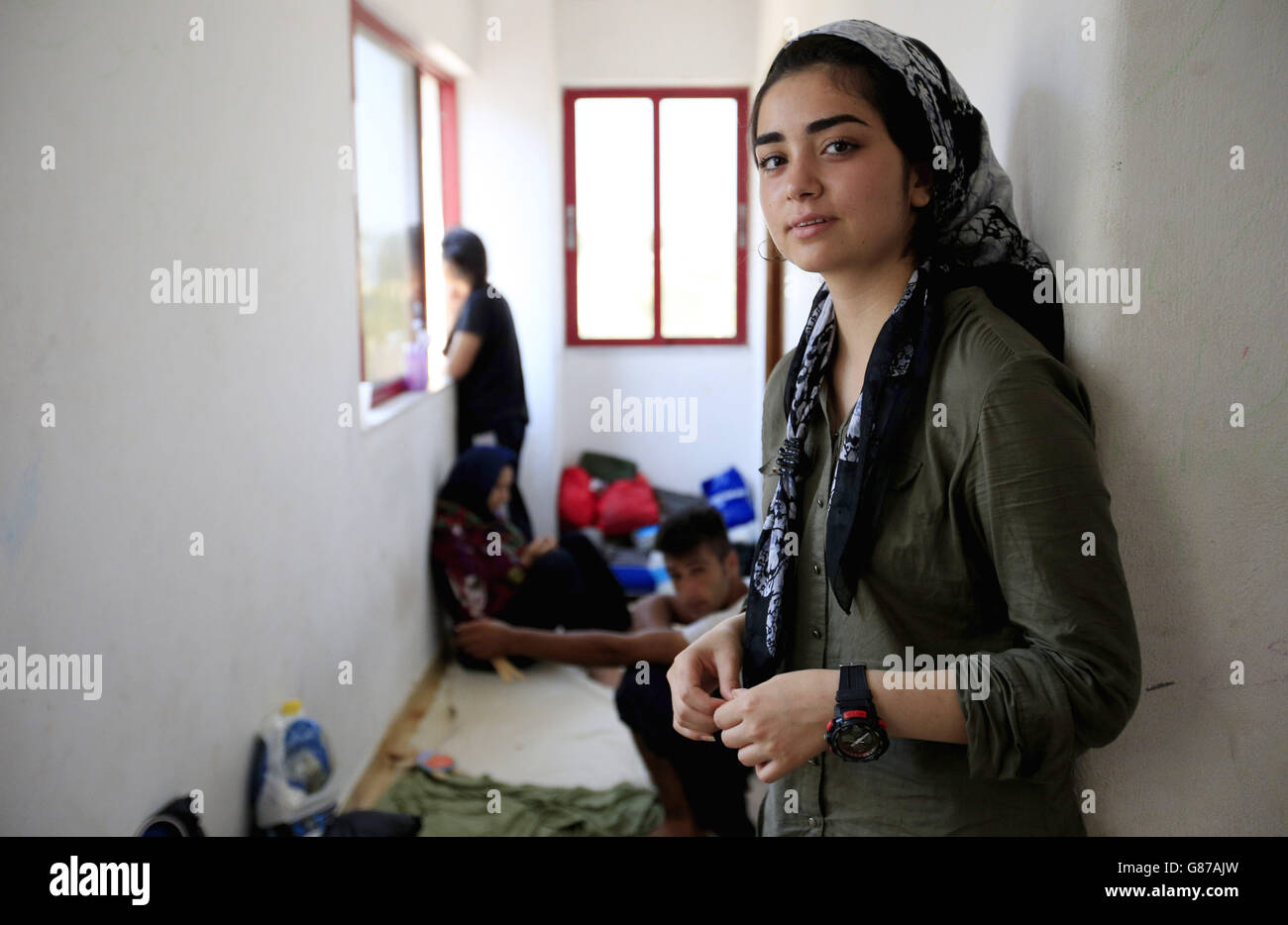 Afghan migrant Parisa, 19, (surname witheld) stands in the corridor in ...