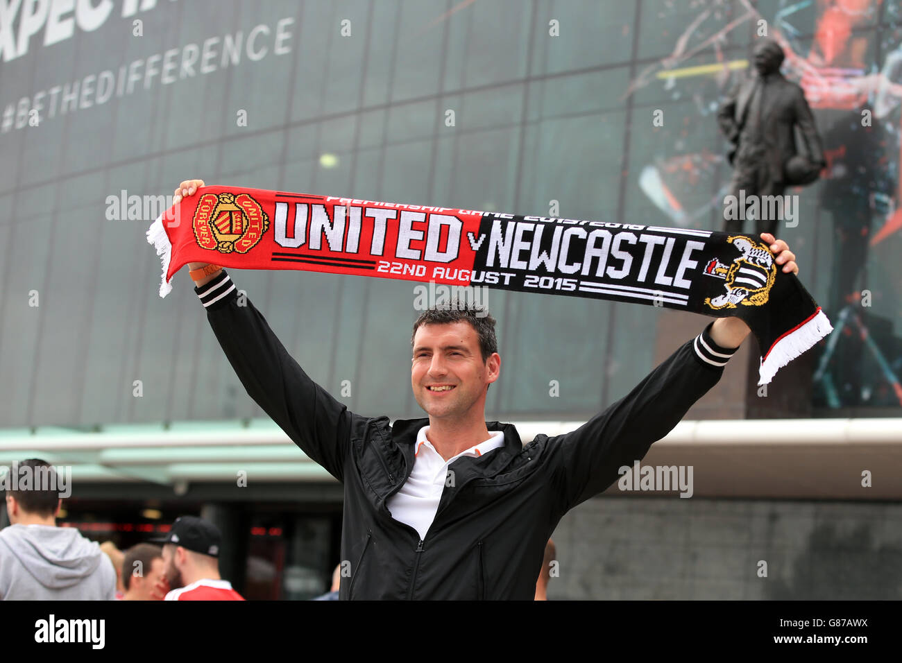 A Manchester United fan shows his support outside the ground before the ...