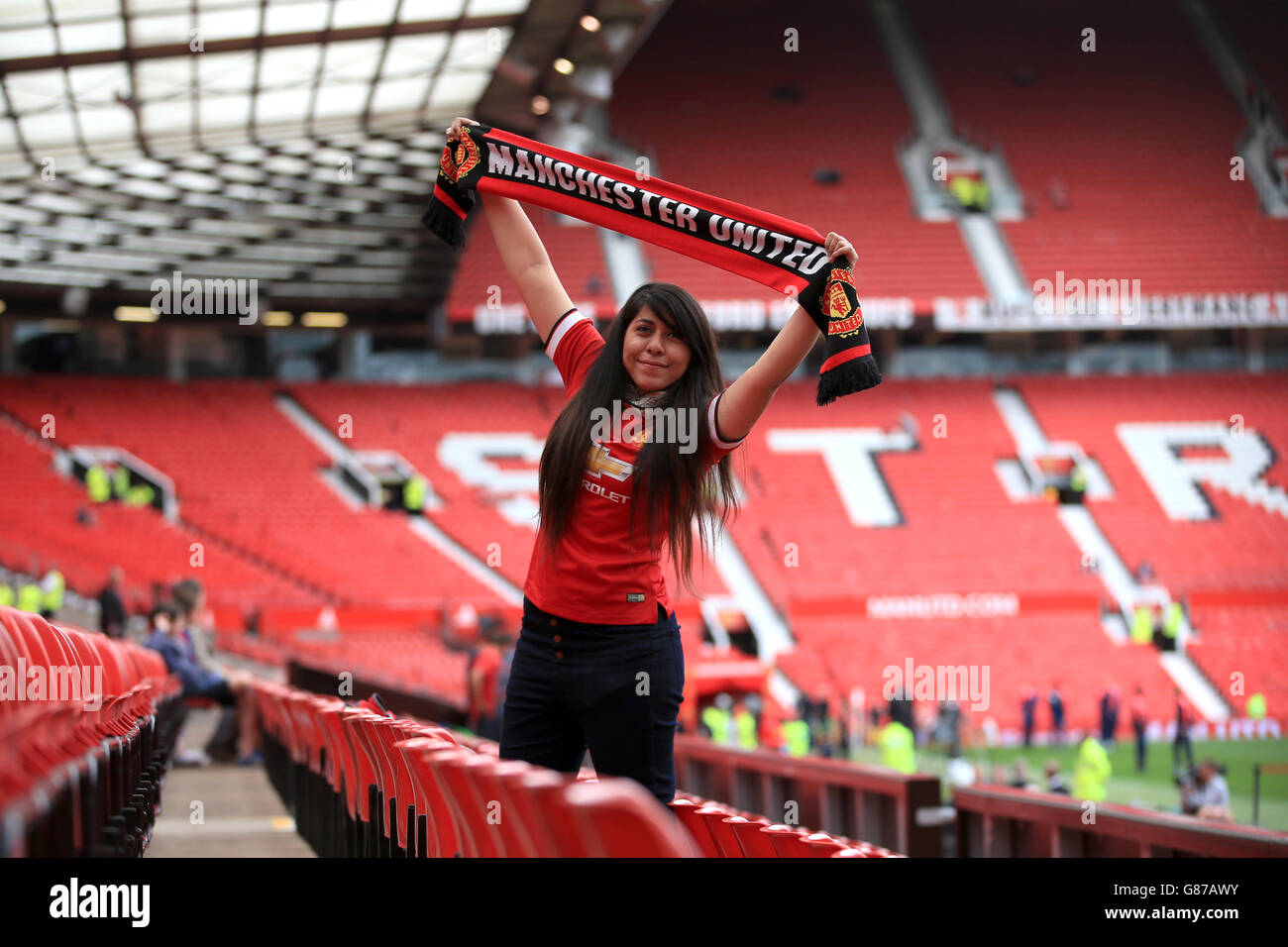 A Manchester United fan shows her support in the stands before the ...