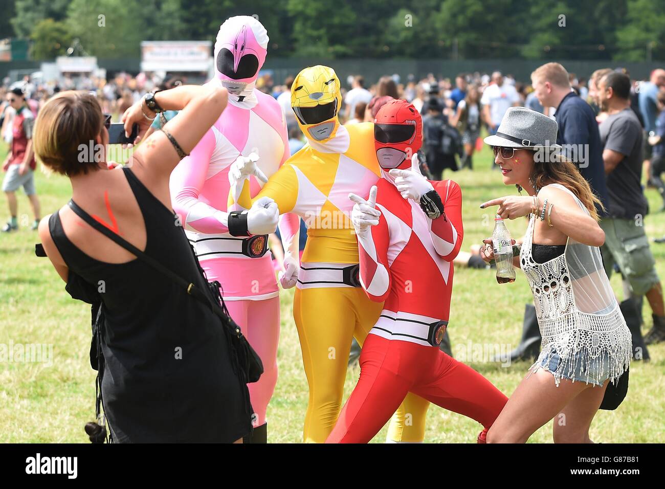 Festivalgoers dressed as Power Rangers pose for a photo during day one ...