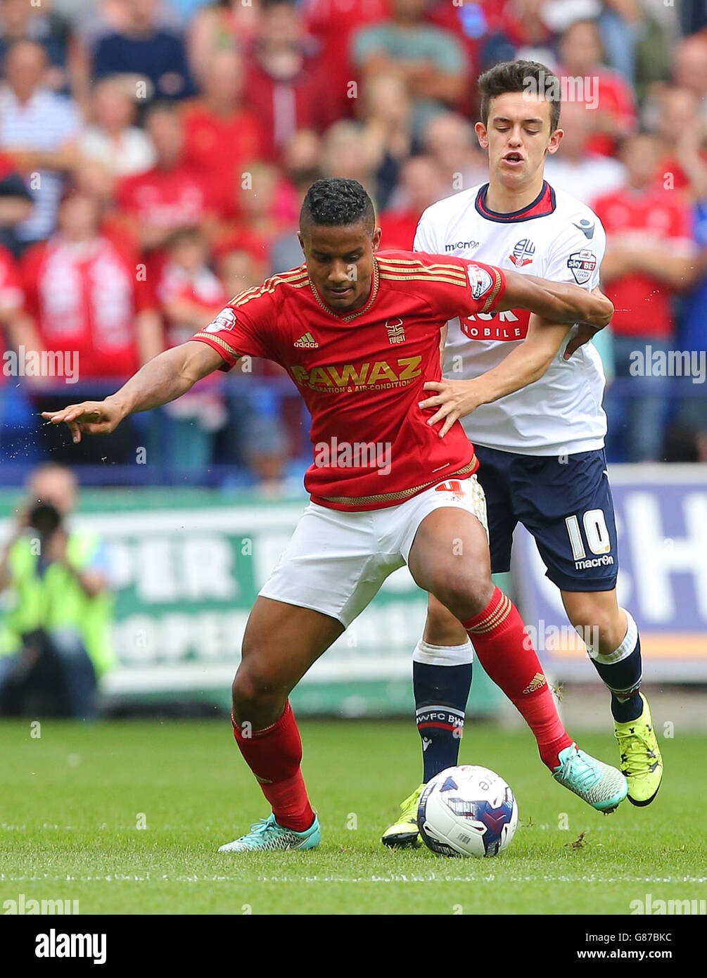 Nottingham Forest's Michael Mancienne holds off Bolton Wanderers' Zach ...