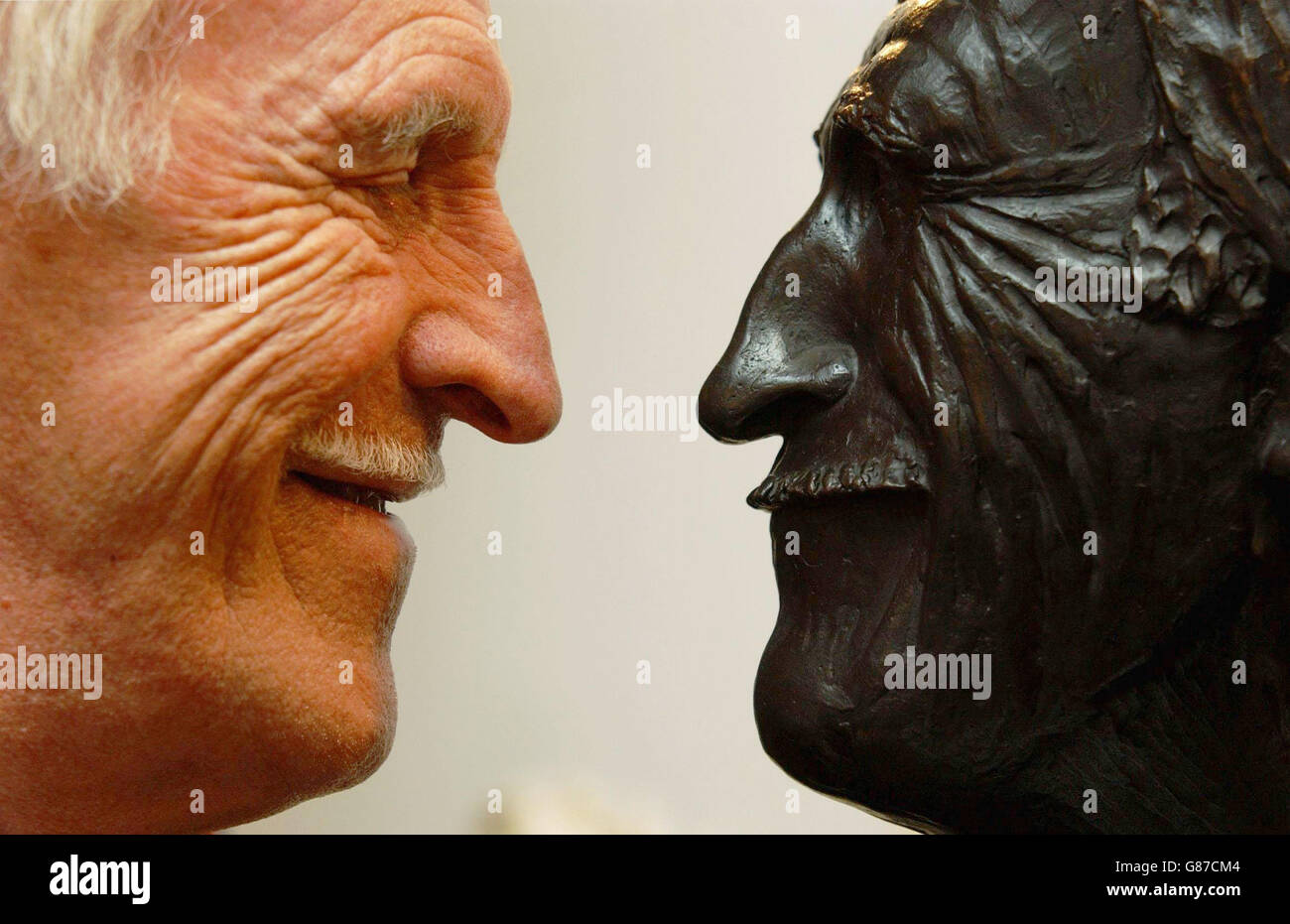 Entertainer Bruce Forsyth with the bust of himself. The bust has been ...