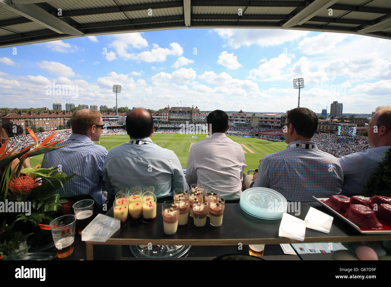 Fans watch the action from the hospitality balcony at the Kia Oval ...