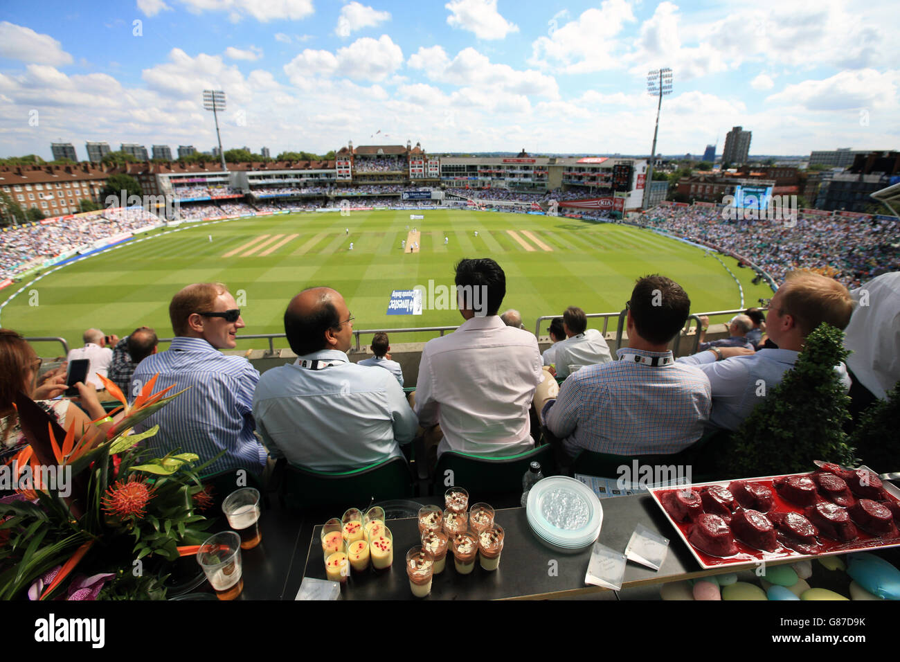 Fans watch the action from the hospitality balcony at the Kia Oval ...