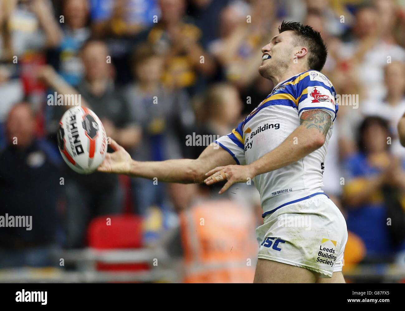 Leeds Rhinos' Tom Briscoe celebrates after scoring their eighth try ...