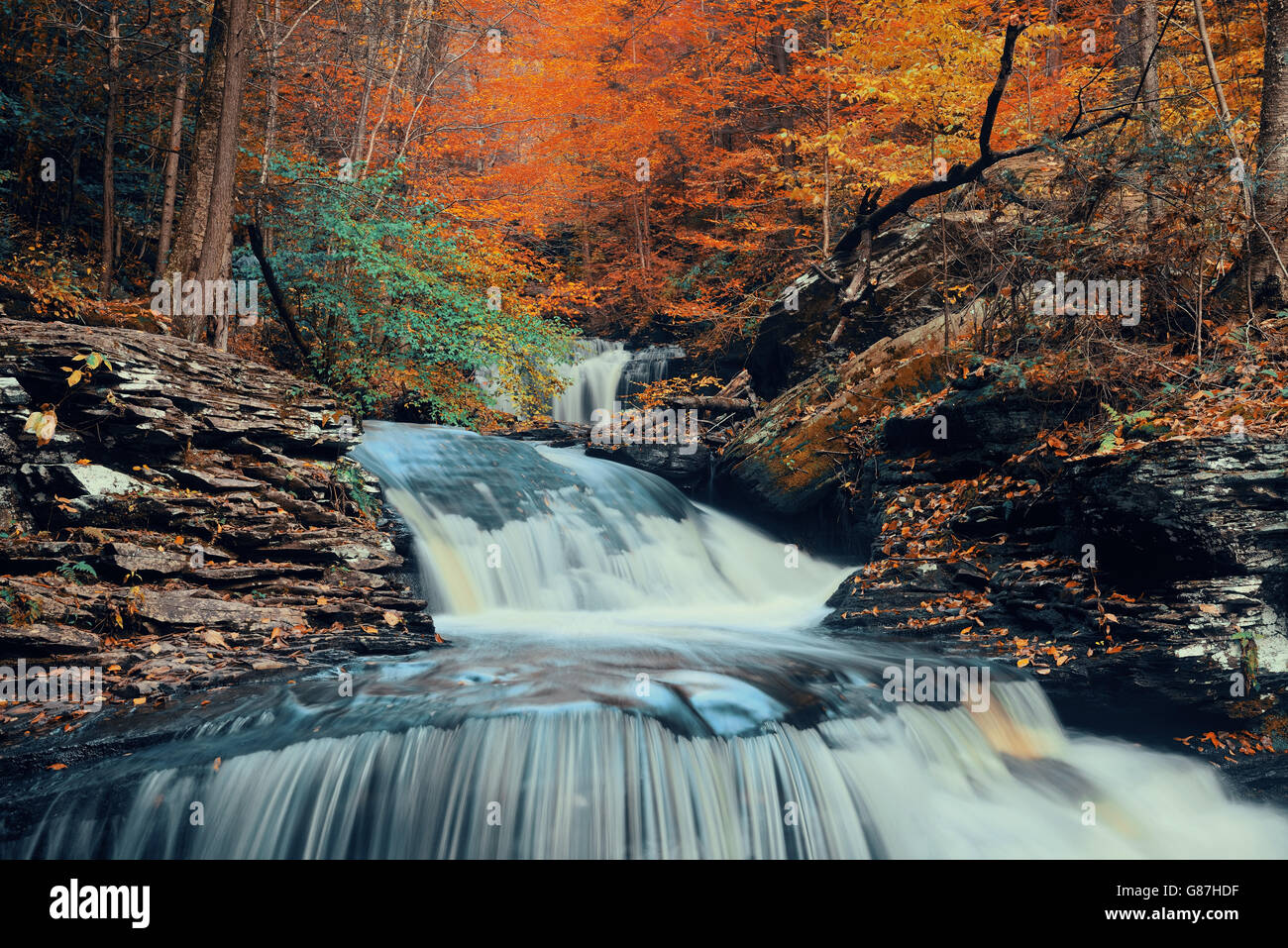 Autumn waterfalls in park with colorful foliage Stock Photo - Alamy