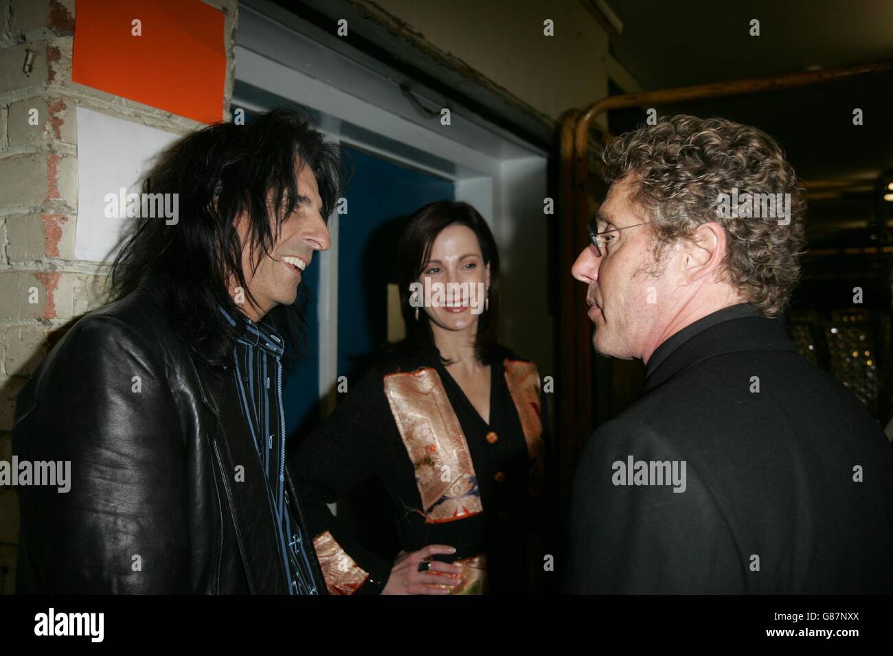 Alice Cooper, left, and his wife talk to Roger Daltrey, former lead ...