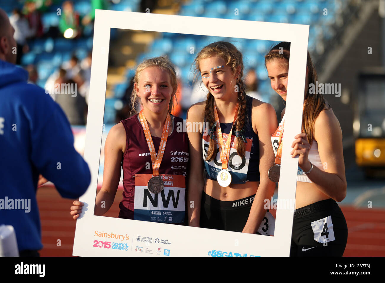 The girls 1500m medal winners pose for a photo after the medal ceremony ...