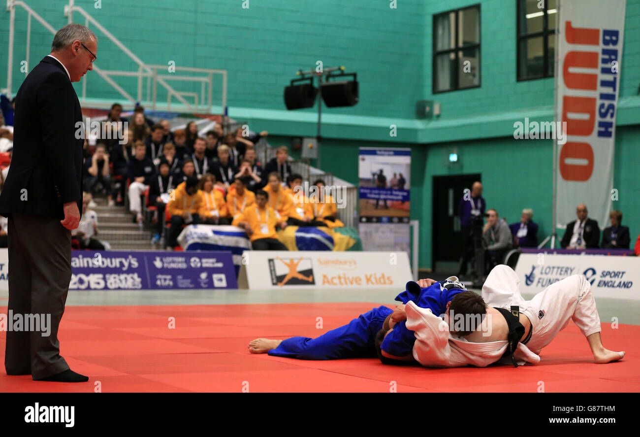 Scotland's Harry Mustard (blue) and Wales' Iwan Cavil (blue) compete in ...