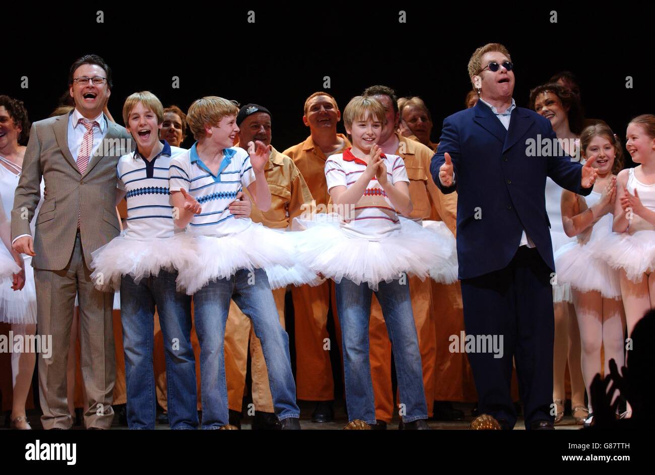 Billy Elliot actors (centre, left to right) James Lomas, George McGuire ...