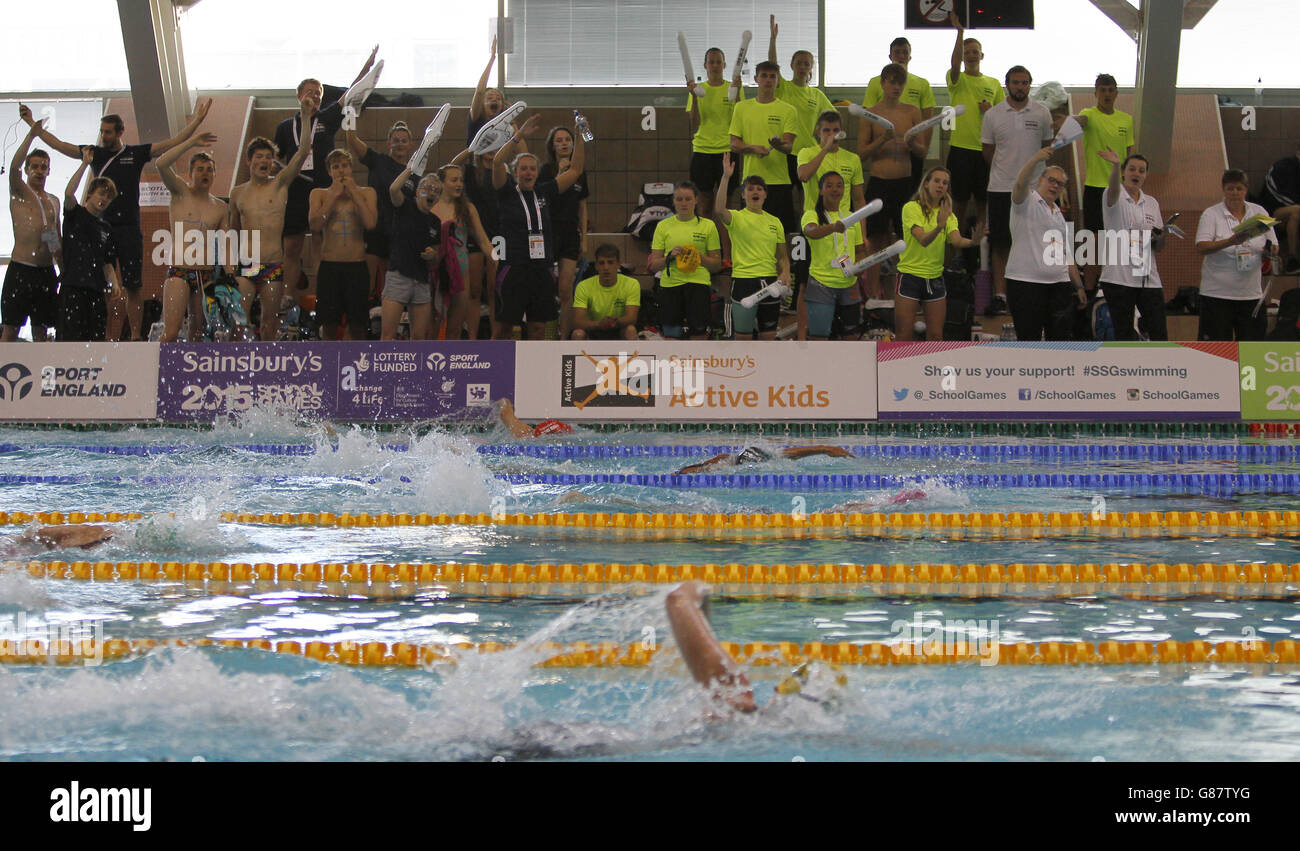 Swimmers cheer on their teammates from poolside at the Sainsbury's 2015 ...