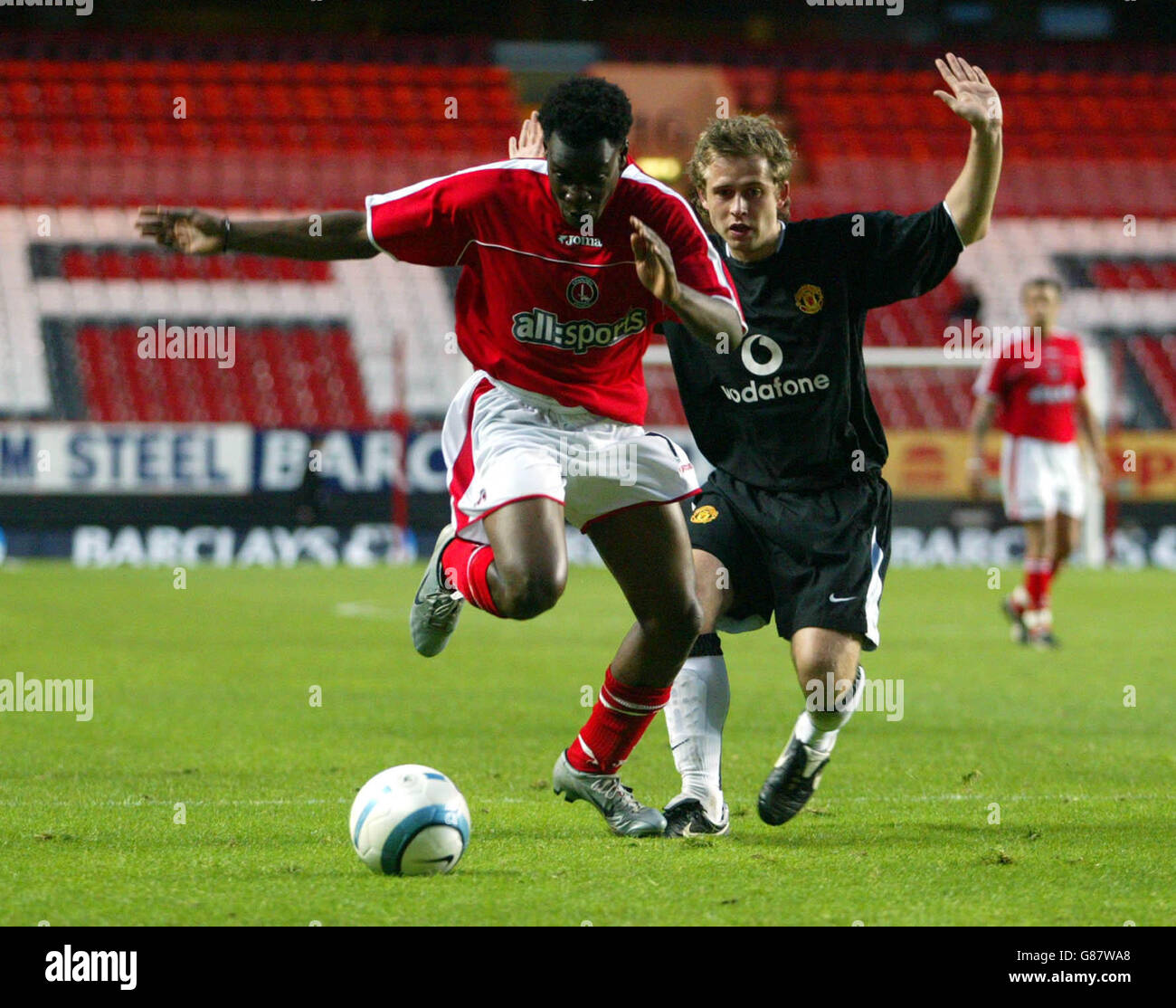 Charlton Athletic's Lloyd Sam is fouled by Manchester United's David ...