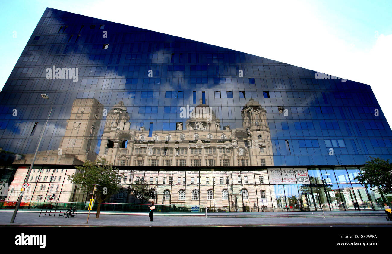A reflection of the Port of Liverpool Building seen in a glass building ...