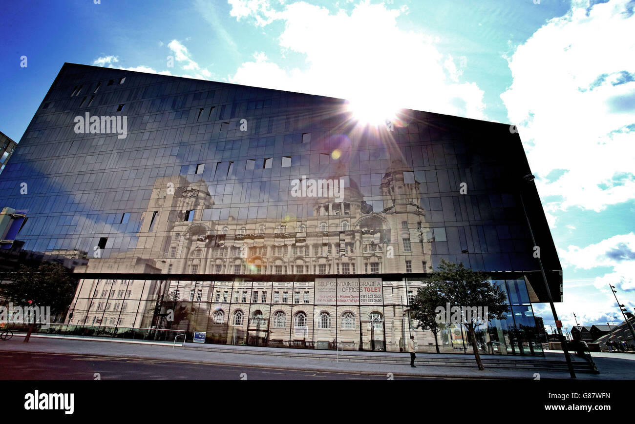 A reflection of the Port of Liverpool Building seen in a glass building ...