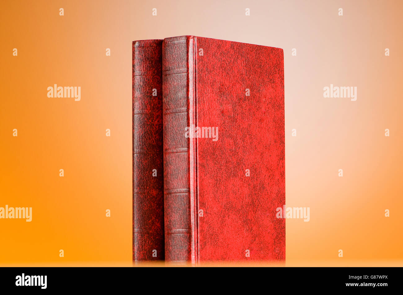 Education concept with red cover books Stock Photo - Alamy
