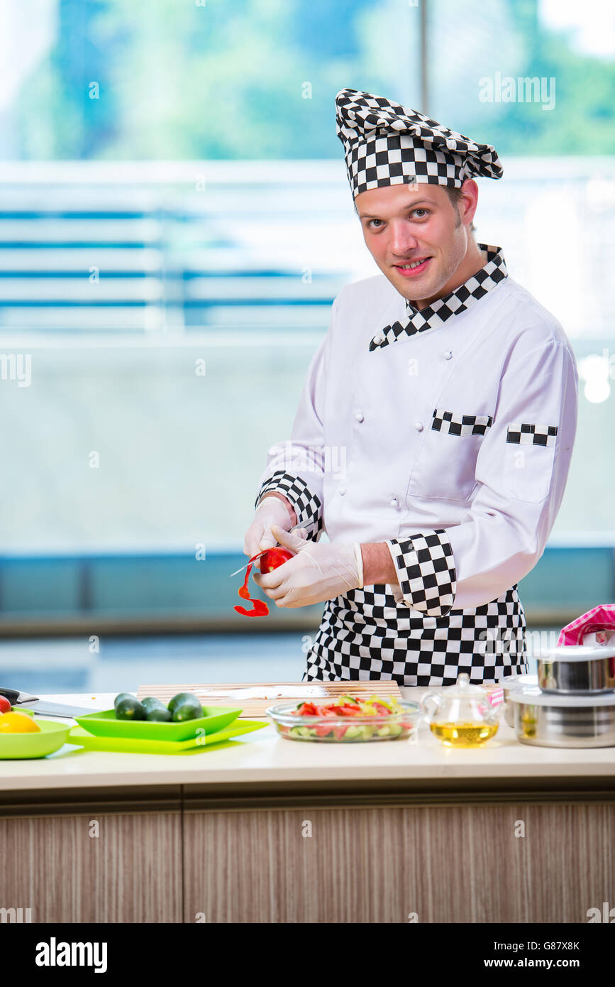 Male cook preparing food in the kitchen Stock Photo - Alamy