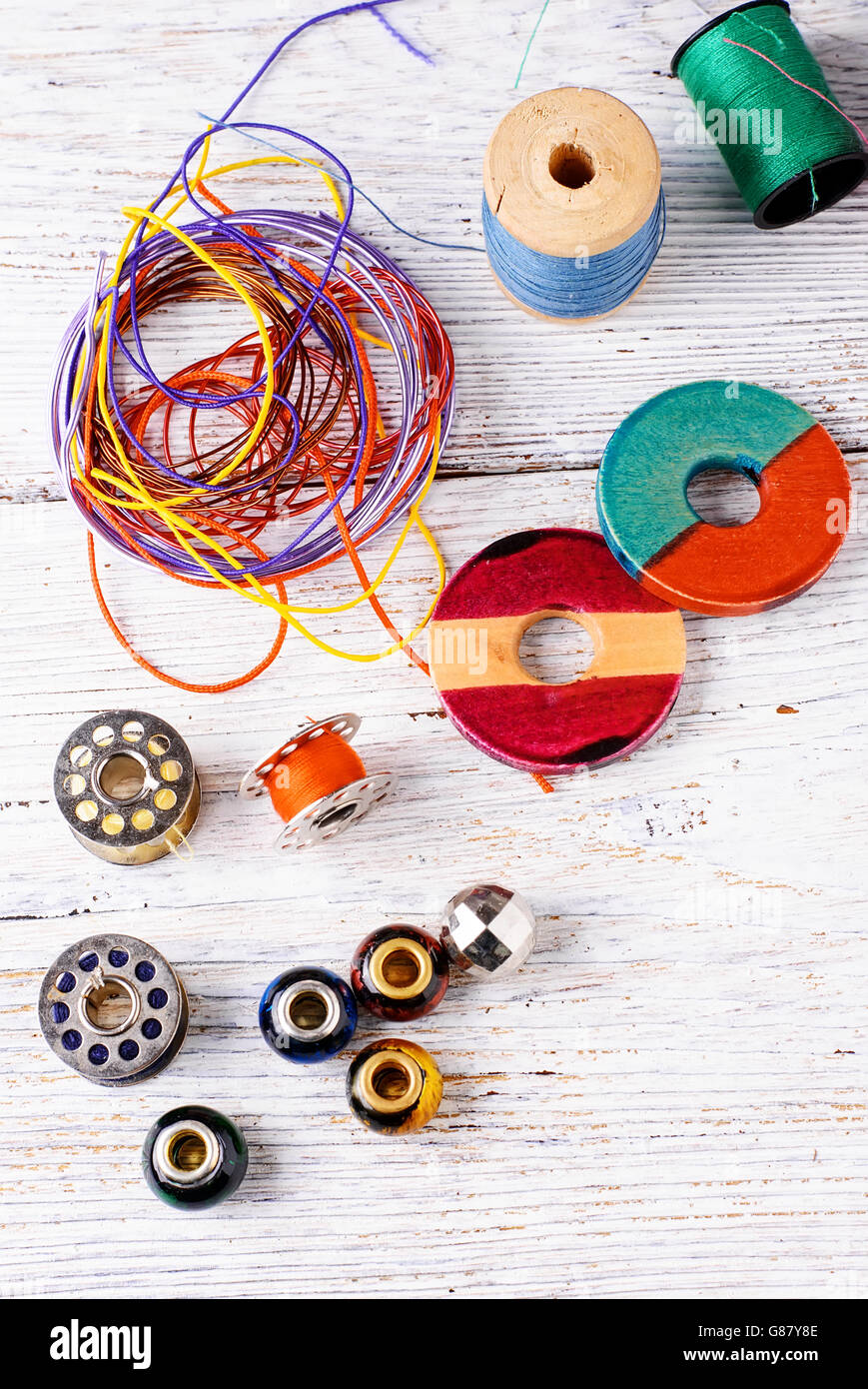 Beads and thread working tools for craft and skill Stock Photo - Alamy