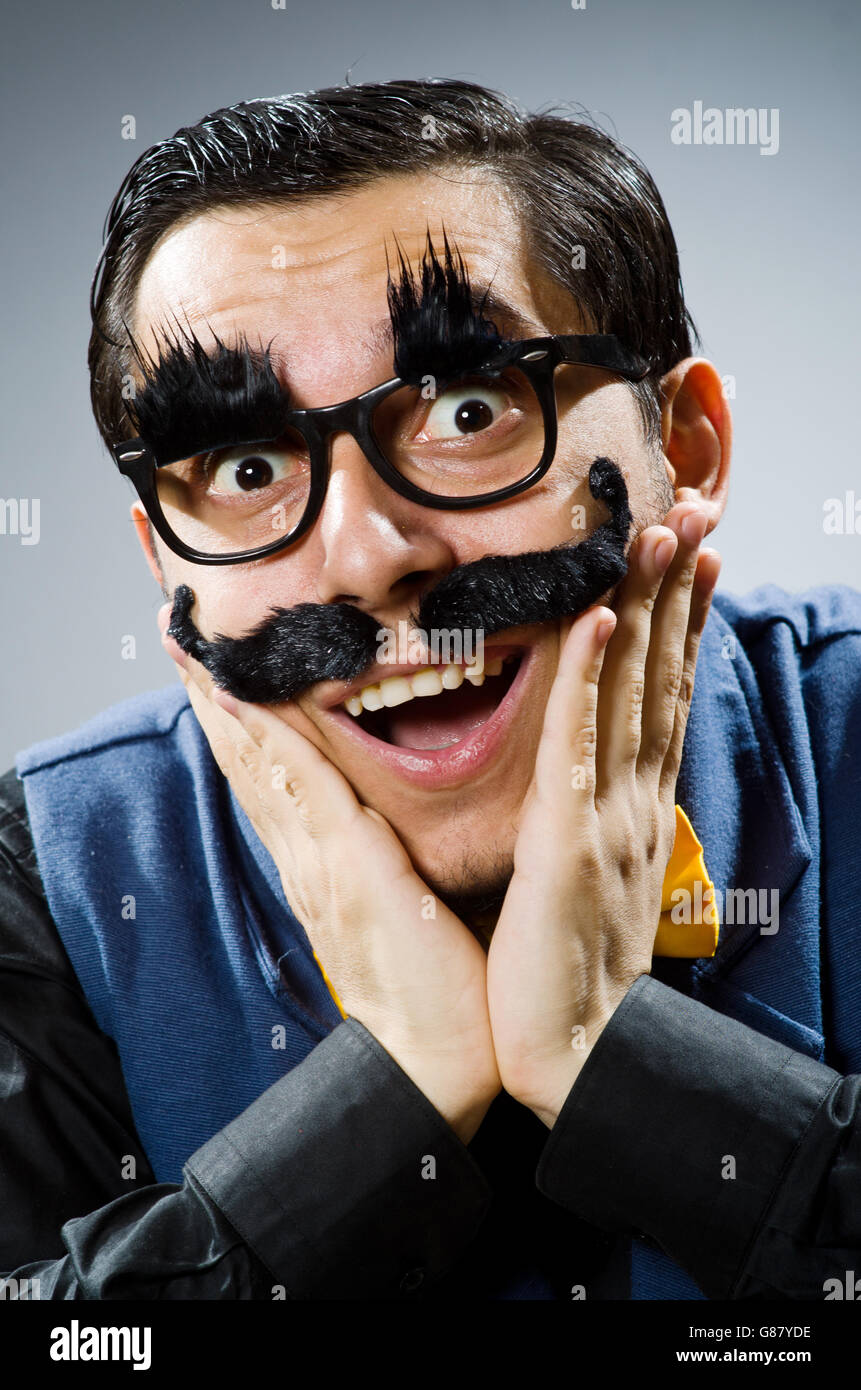 Funny man against dark background Stock Photo - Alamy