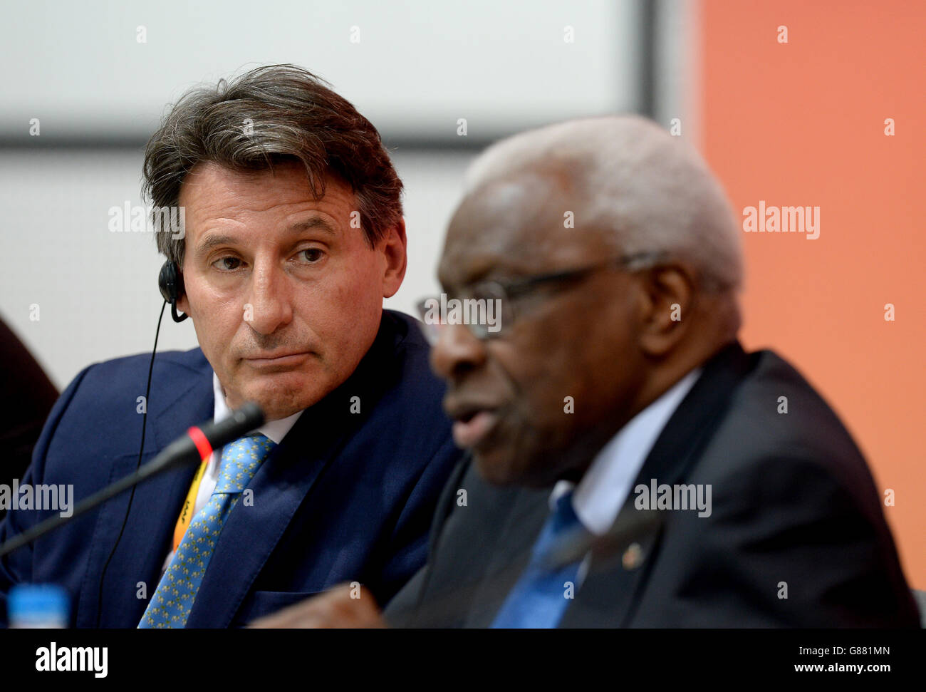 Incoming IAAF president Sebastian Coe looks on as outgoing president ...