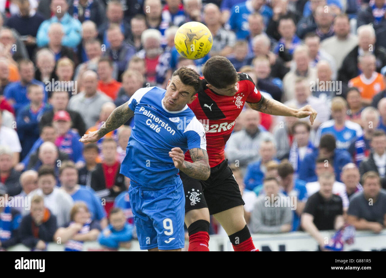 Rangers' Rob Kiernan (right) Queen of the South Derek Lyle battle for ...