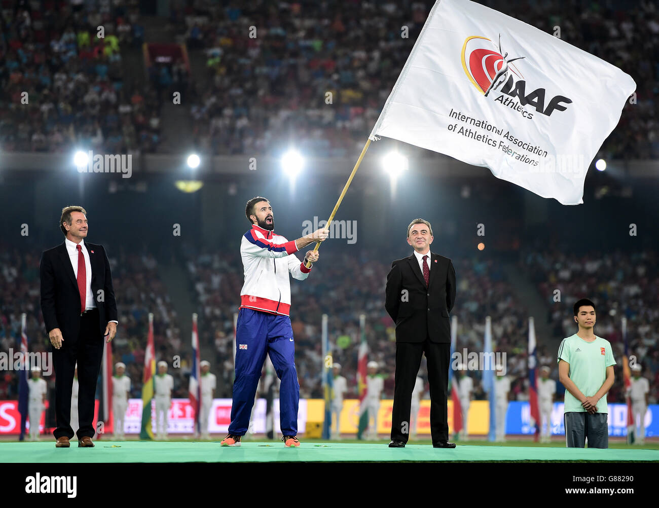 Great Britain captain Martyn Rooney waves the IAAF flag as UK Athletic ...