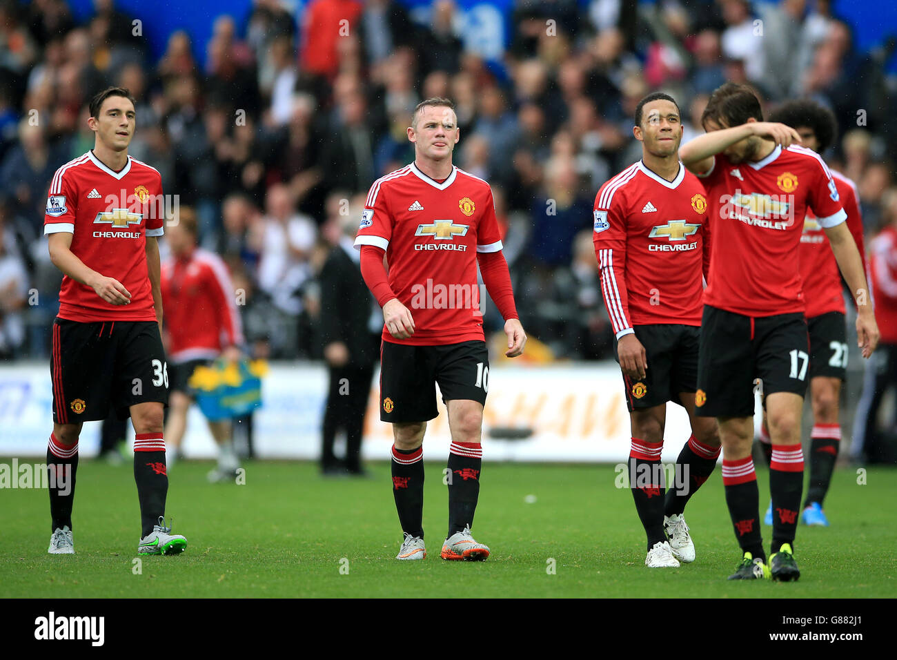 Manchester United players look dejected after the final whistle during ...