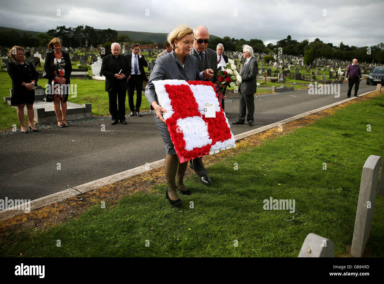 Polish MEP Anna Fotyga lays a wreath at the graves of seven Polish ...