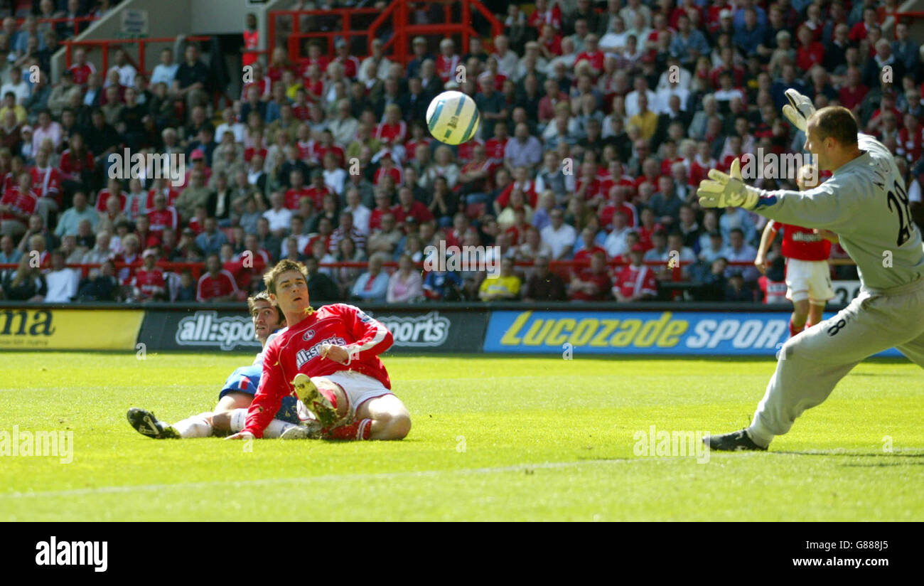 Charlton Athletic's Bryan Hughes (c) on floor scores the opening goal ...
