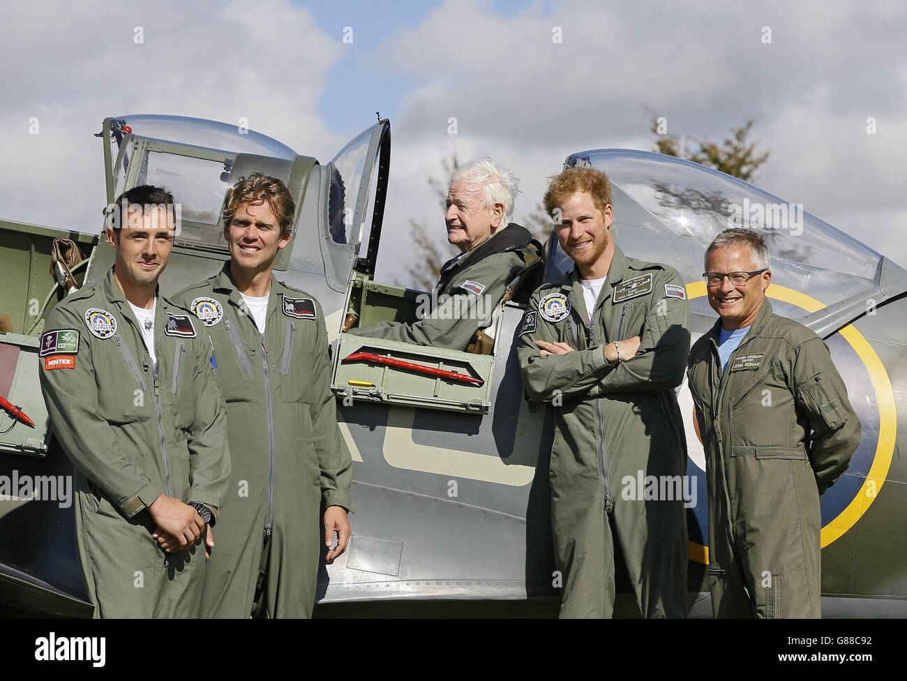 Prince Harry (second right) poses for a photograph with pilots and ...