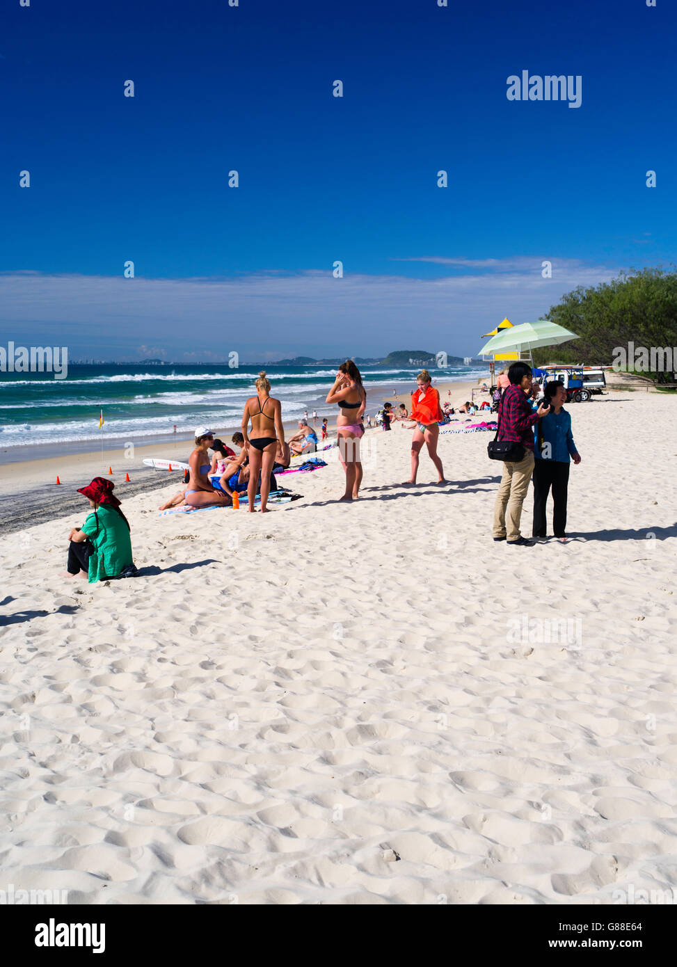 Gold coast beach australia man woman hi-res stock photography and ...