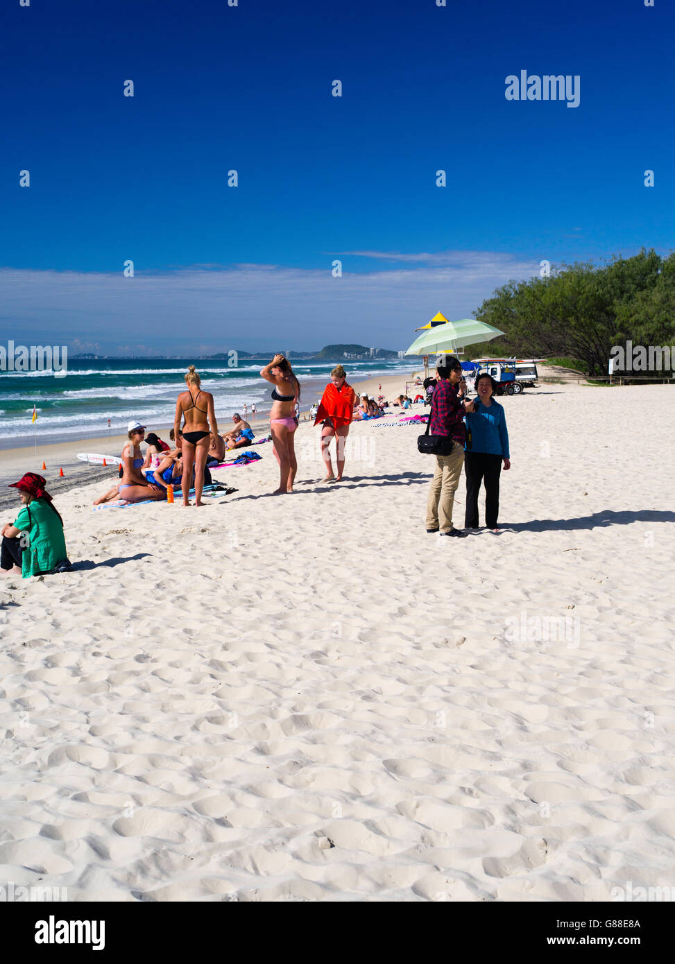 Gold coast beach australia man woman hi-res stock photography and ...