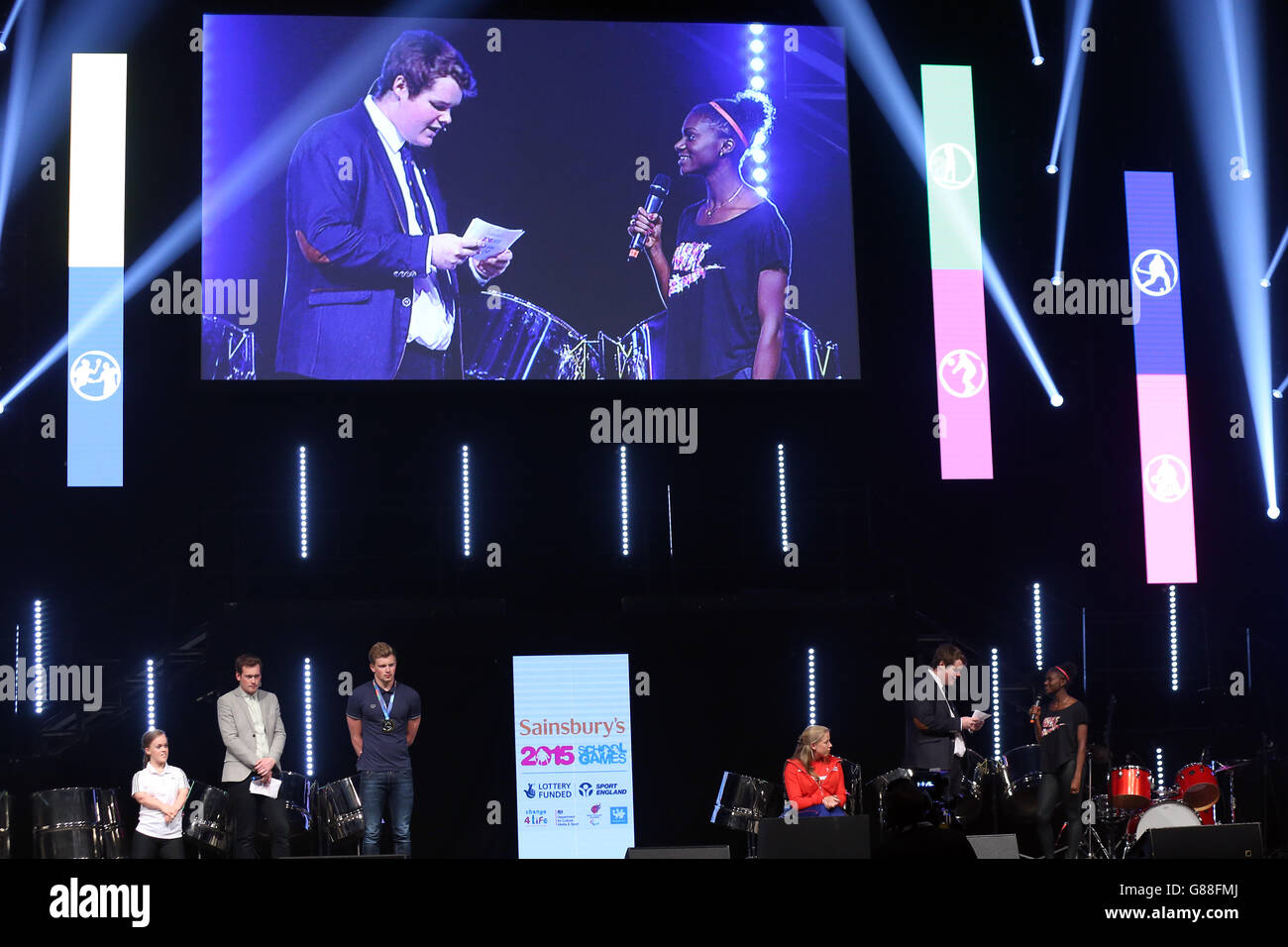 Elliott Mather speaks to Dina Asher-Smith during the opening ceremony ...