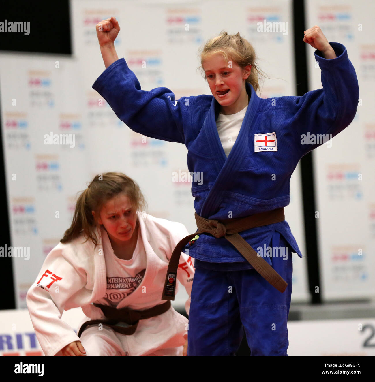 England's Darcie Hancocks (blue) celebrates winning against Scotland's ...