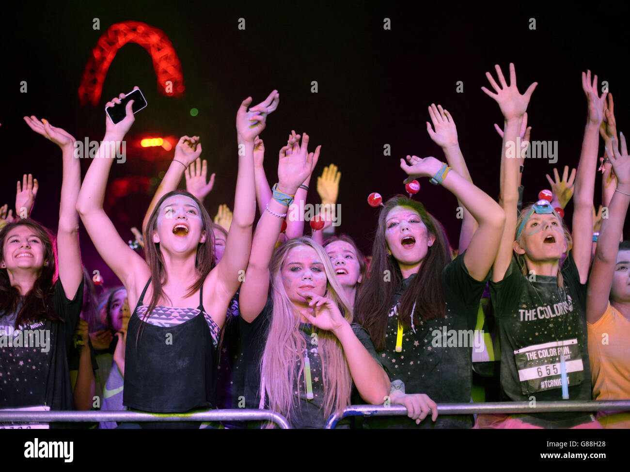 The Color Run Night. People take part in The Color Run Night at Queen ...