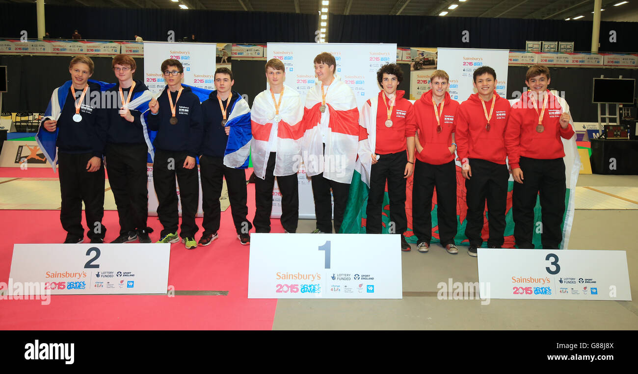 England (centre) celebrate their victory in the Men's Fencing Team ...