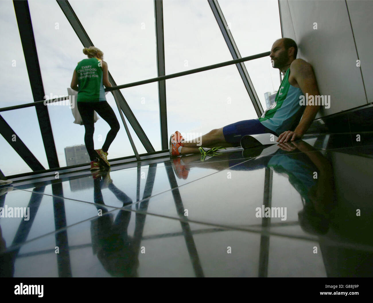 Runners at the top of the Gherkin building in the City of London after ...