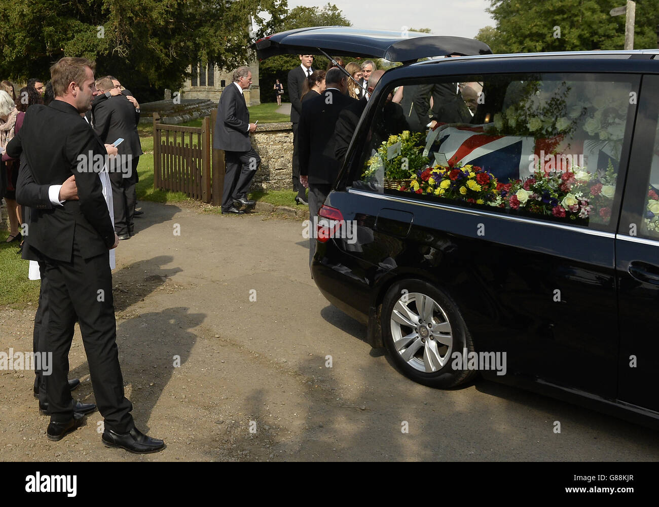 The coffin of Justin Wilson sits in the hearse after his funeral at St ...