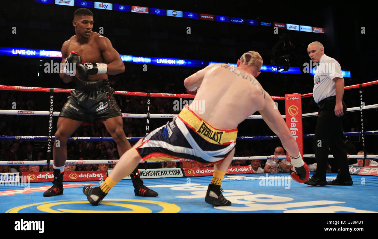 Boxing - O2 Arena. Anthony Joshua (left) knocks down Gary Cornish in ...