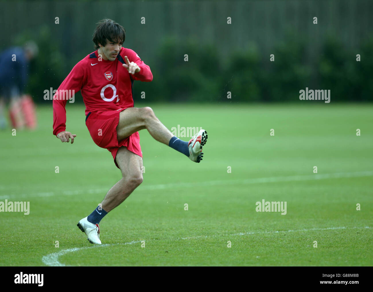 Arsenals robert pires practices his free kicks during training hi-res ...