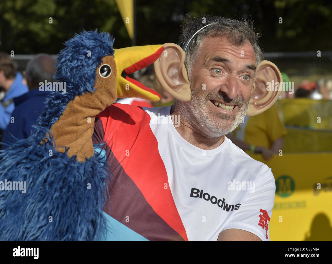 A runner in fancy dress with an Emu puppet before the 2015 Morrisons ...