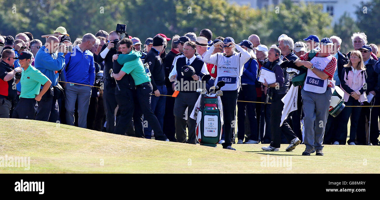 Great Britain and Ireland captain Nigel Edwards hugs Cormac Sharvin ...