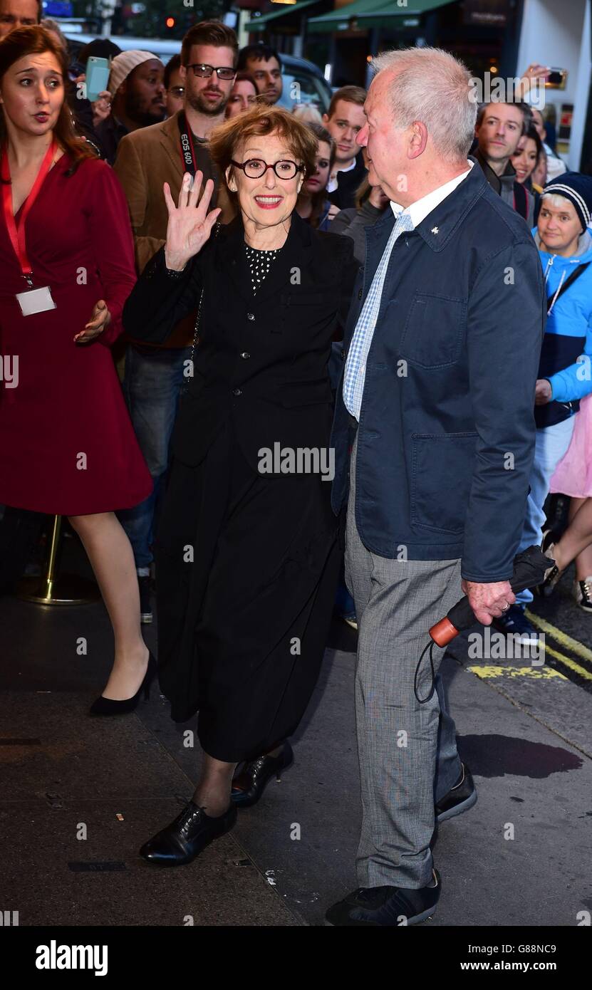 Una Stubbs arrives with an unidentified man as they attend the press ...