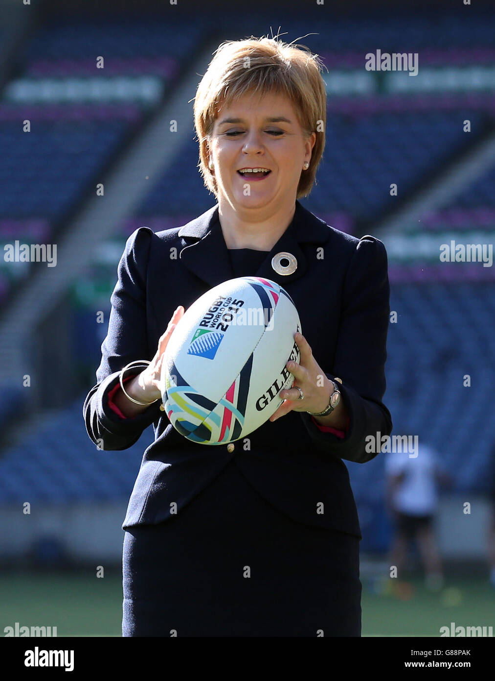 First Minister Nicola Sturgeon throws a rugby ball as she meets the ...