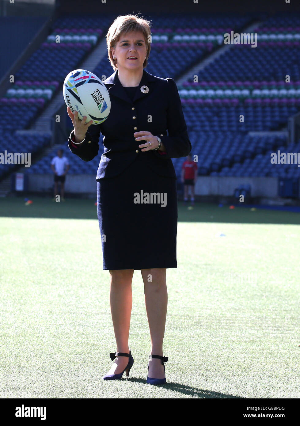 First Minister Nicola Sturgeon throws a rugby ball as she meets the ...