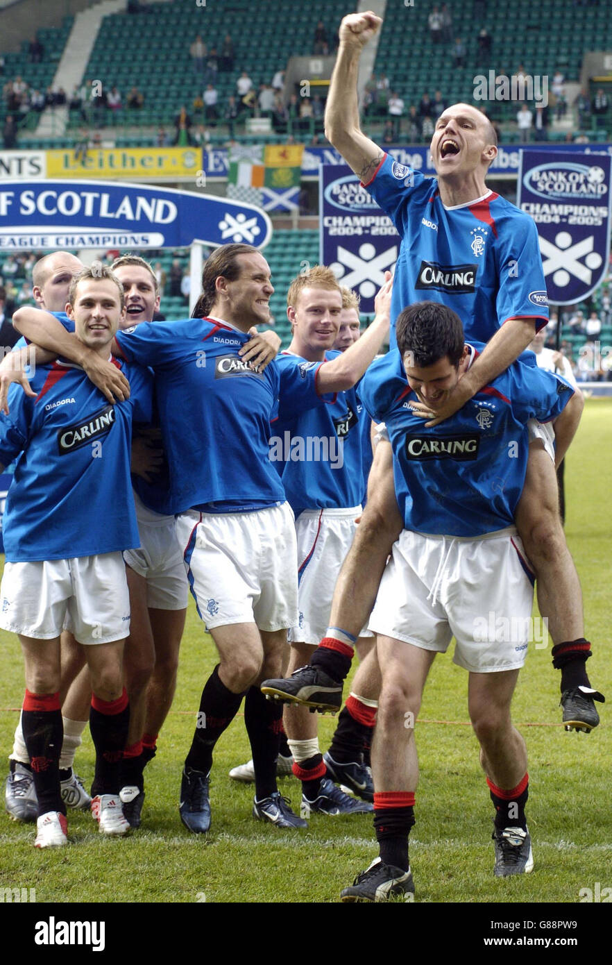Rangers' Alex Rae jumps on the back of Steven Thompson after winning ...